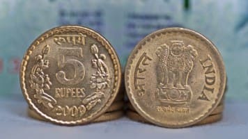 Rupee covers up early loss, rules flat