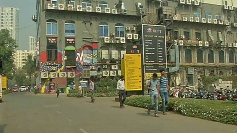 How did Mumbai's large textile mills turn into crowded clusters of ...