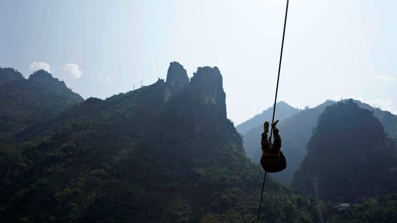 With no roads or bridges, mountain dwellers zipline their way over ...