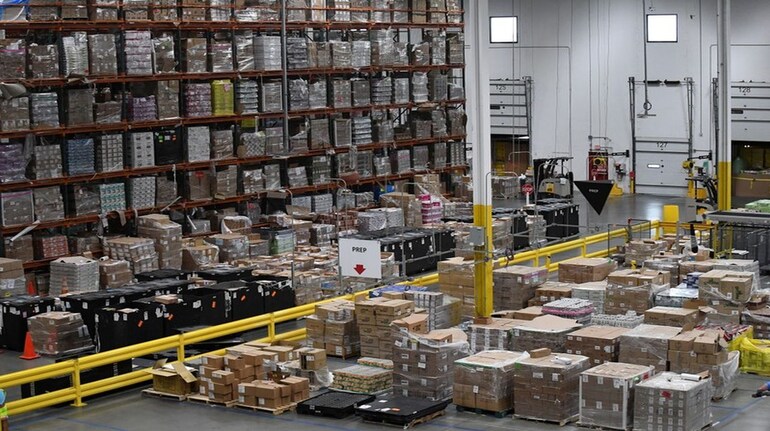Amazon rolls out machines that pack orders and replace jobs