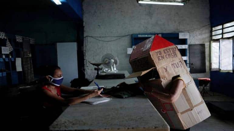 Cuban dons full-body cardboard shield against coronavirus