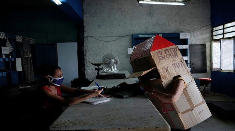 Cuban dons full-body cardboard shield against coronavirus