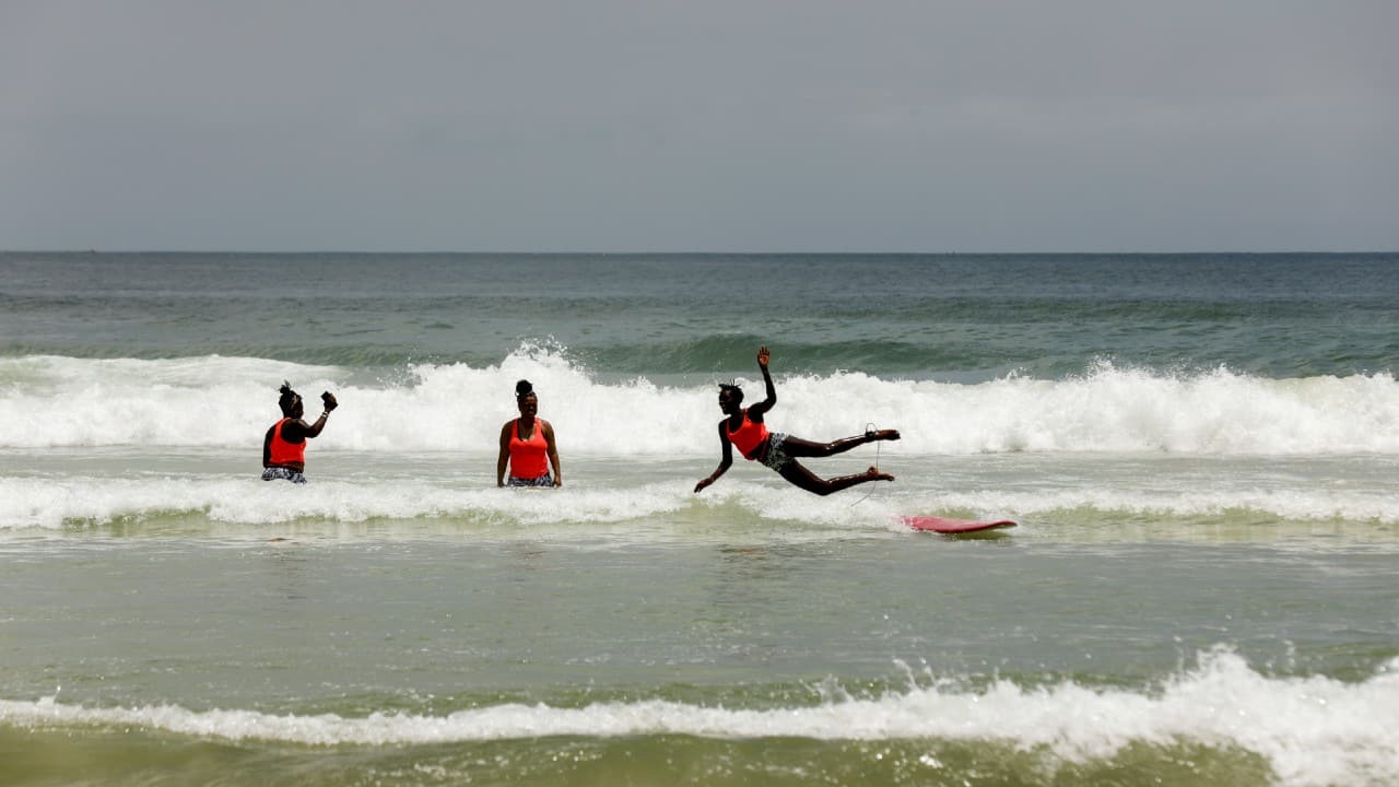 In pics | Senegal’s first female pro surfer takes to the waves to defy ...