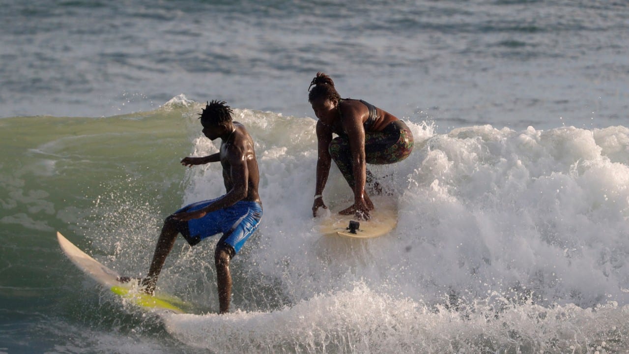In pics | Senegal’s first female pro surfer takes to the waves to defy ...