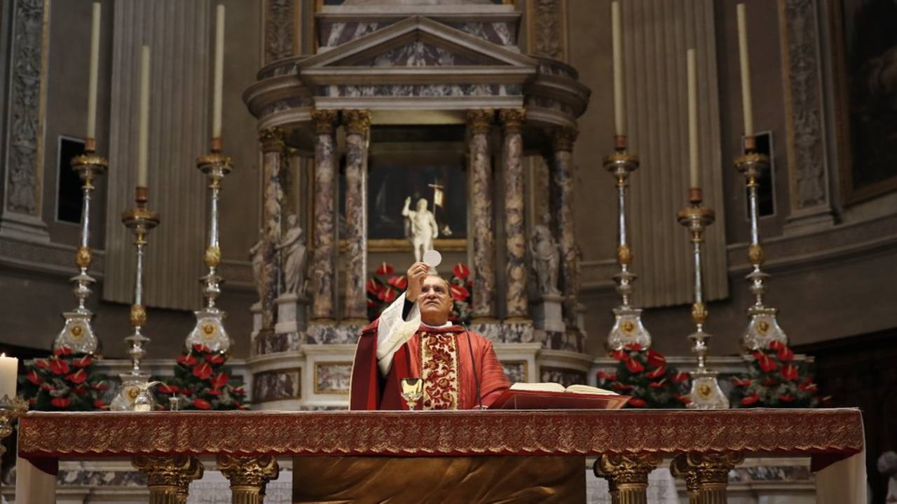 In pictures: At coronavirus milestone, Italian priest reflects on loss ...