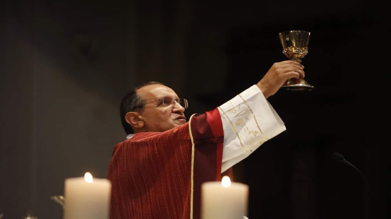 In pictures: At coronavirus milestone, Italian priest reflects on loss ...