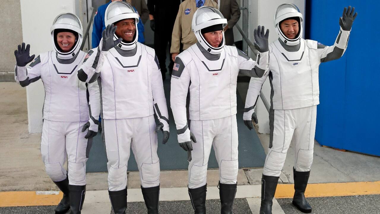 SpaceX Crew Dragon Resilience capsule carrying four astronauts docks ...