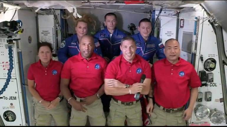 SpaceX Crew Dragon Resilience capsule carrying four astronauts docks ...