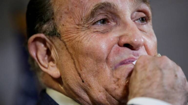 Black hair dye drips down Donald Trump's lawyer Rudy Giuliani's face at ...