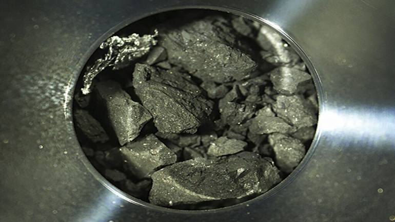 Japanese spacecraft's gifts: Asteroid chips like charcoal