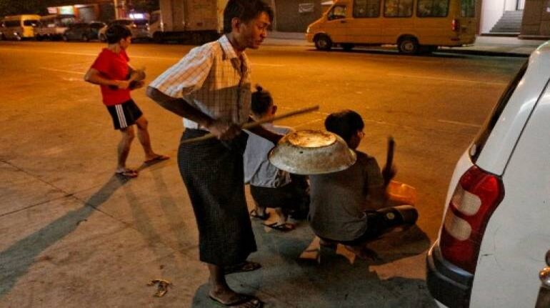 People in Myanmar honk horns, bang on pots to protest coup