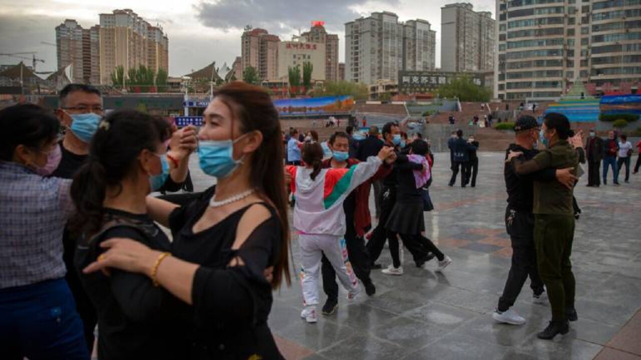 People wearing protective masks to help curb the spread of the ...