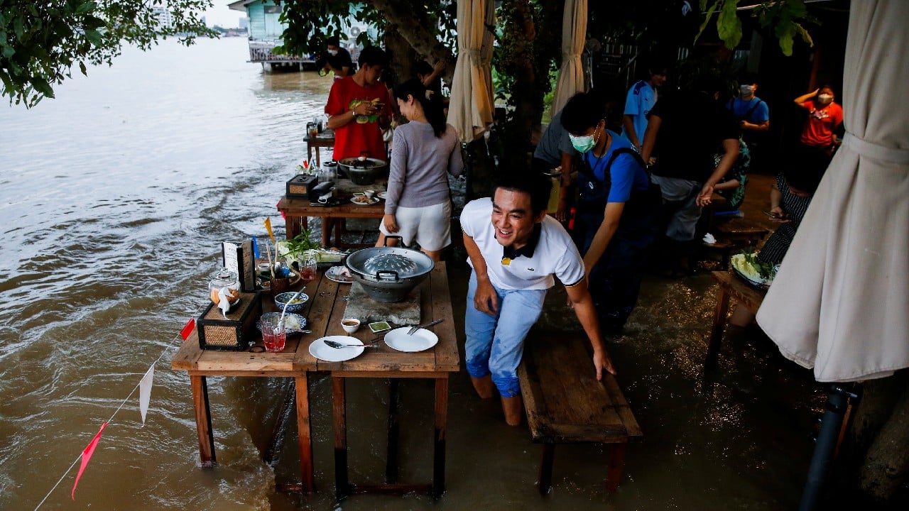 Riverside restaurant makes waves in Thailand as flood dining goes viral