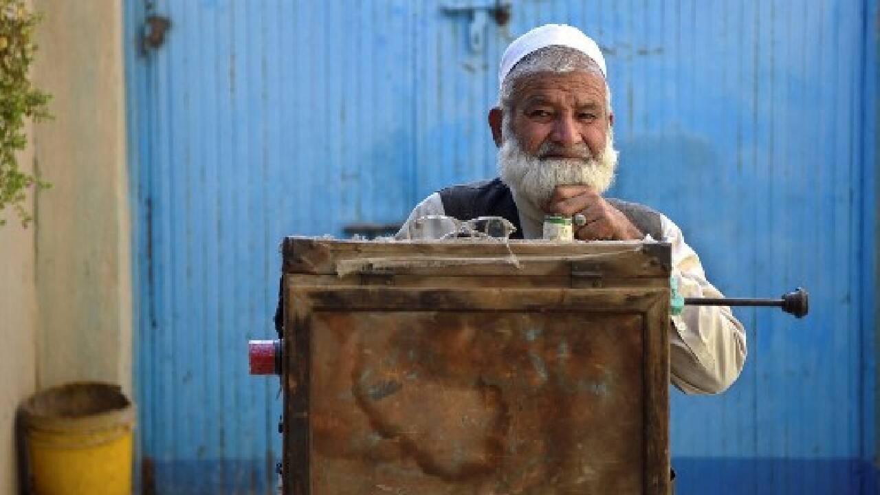 Providing a snapshot of the past, Afghan photographer keeps the box cameras alive | Moneycontrol ...