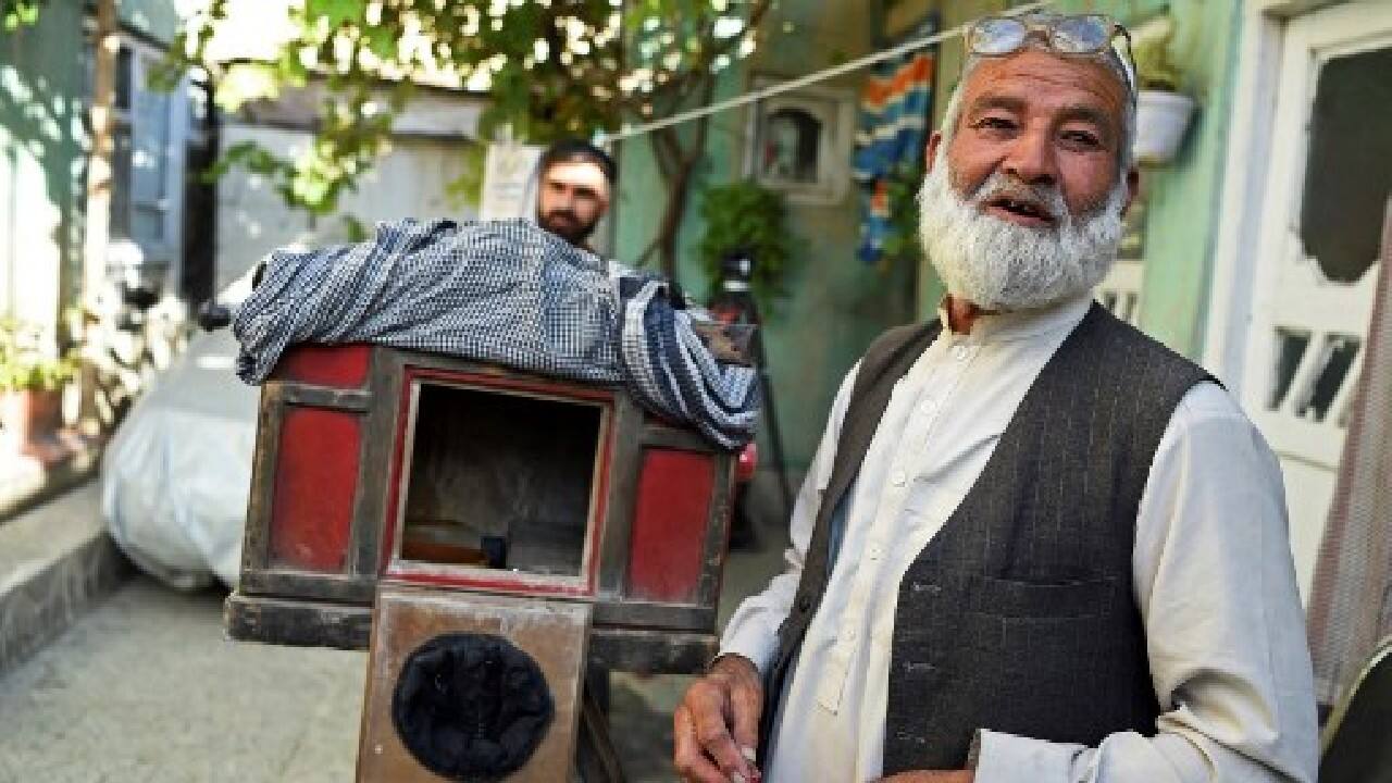Providing a snapshot of the past, Afghan photographer keeps the box ...