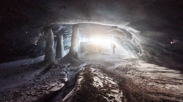 Blue ice cavern in Swiss Alpine glacier delights visitors