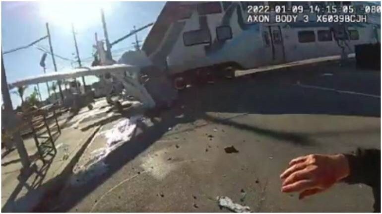 Pilot rescued seconds before speeding train runs over plane. Chilling ...