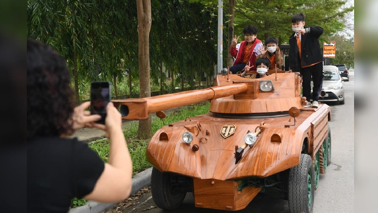 Vietnamese dad spends thousands converting van into wooden tank for son