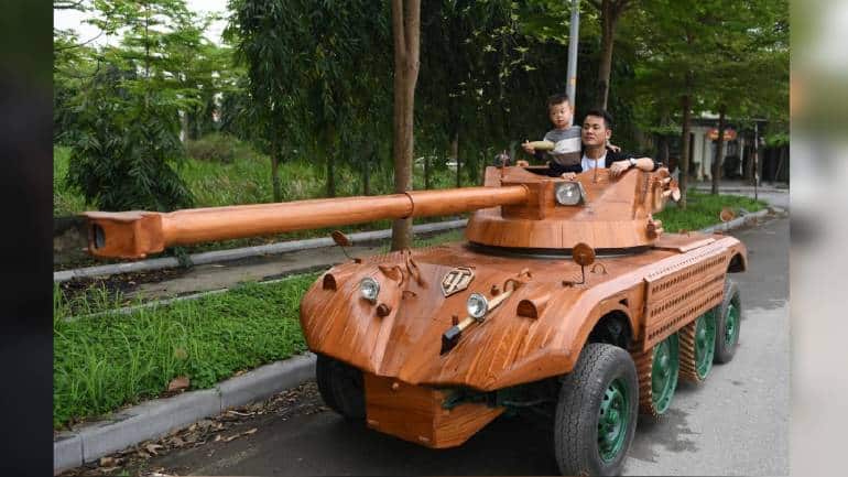 Vietnamese dad spends thousands converting van into wooden tank for son