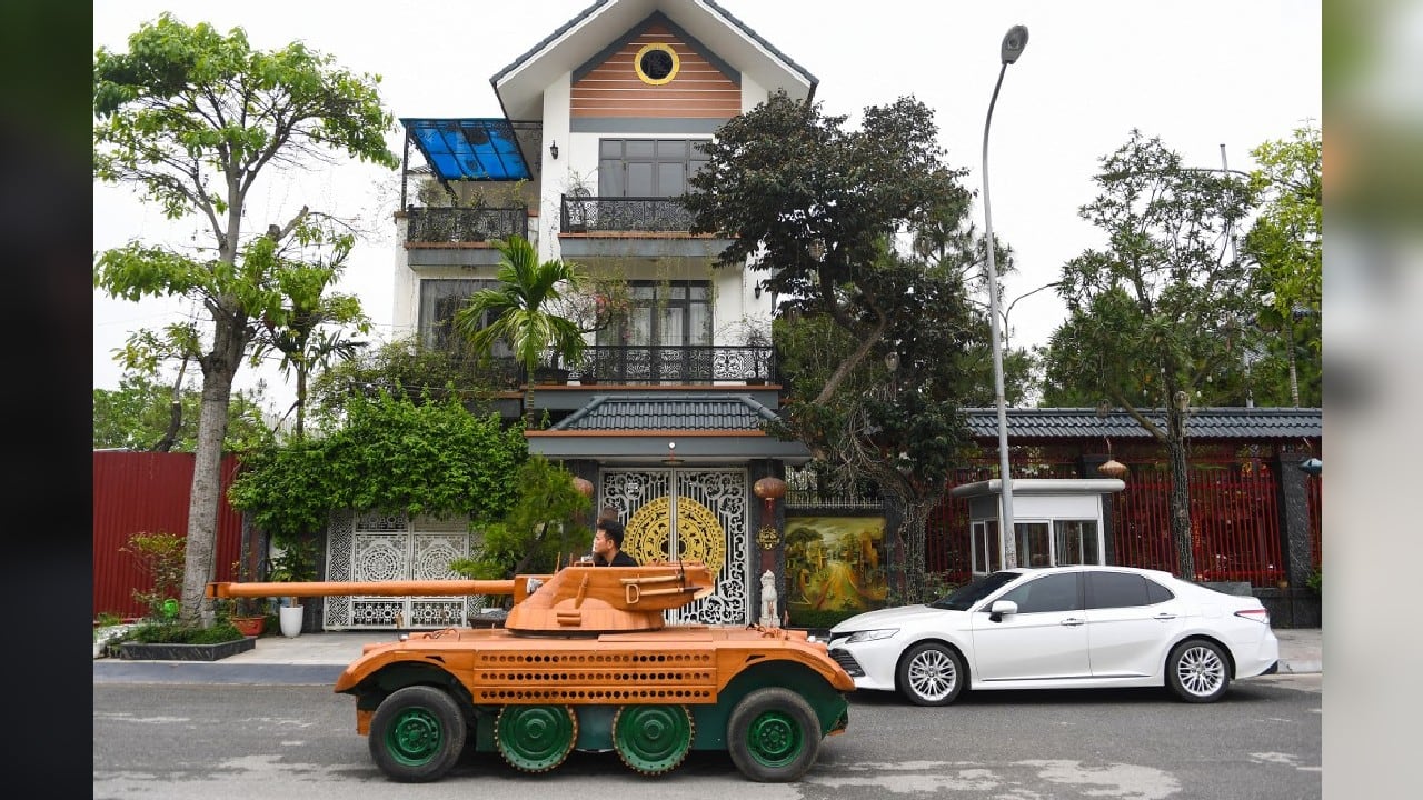 Vietnamese dad spends thousands converting van into wooden tank for son