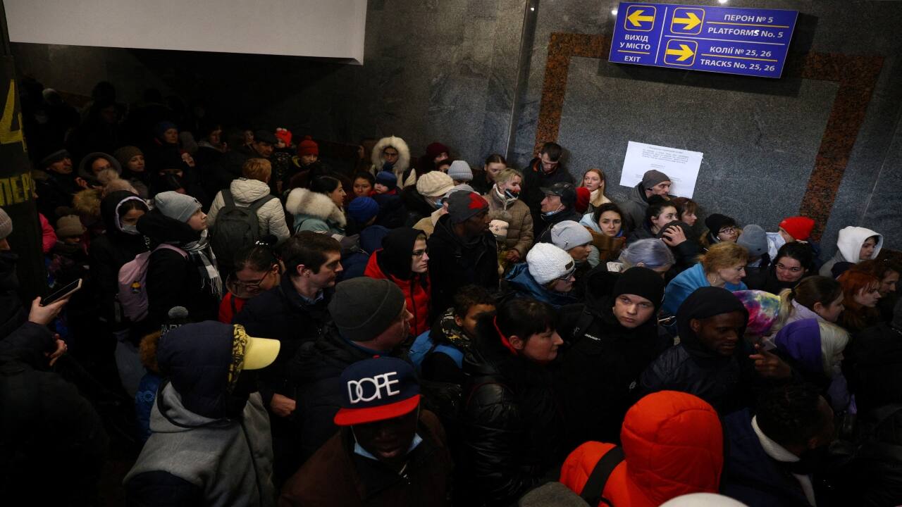 'Women, children first': Gloomy scenes at Ukraine stations as people ...