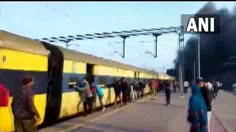 Watch: Passengers push train to separate it from blazing engine in UP