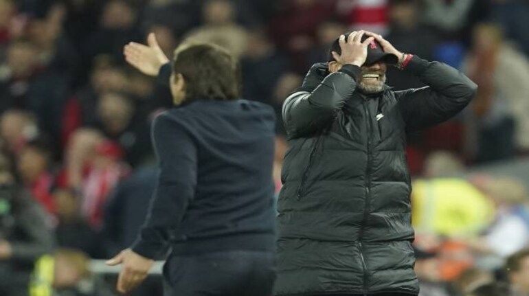 Liverpool slip in title race after being held to a draw by Spurs at Anfield