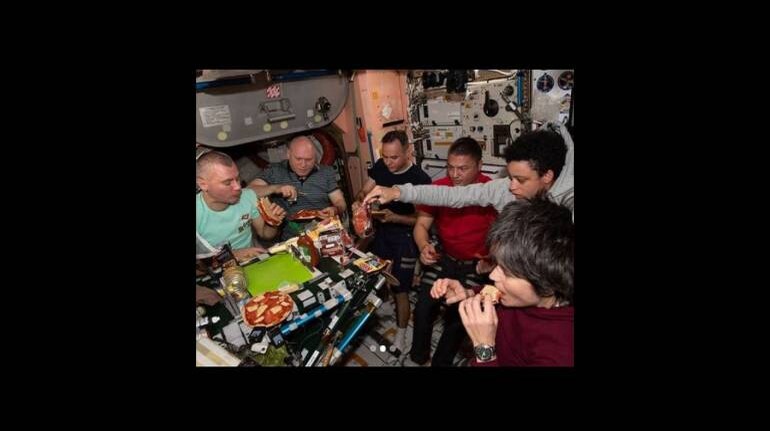 'Pass the pepperoni': Glimpses from a pizza party in space