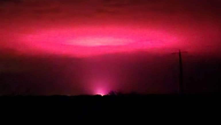 The mystery of the stunning pink glow over Australian town has been solved
