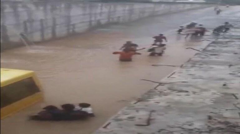 Watch: How school students trapped in submerged bus were rescued in ...