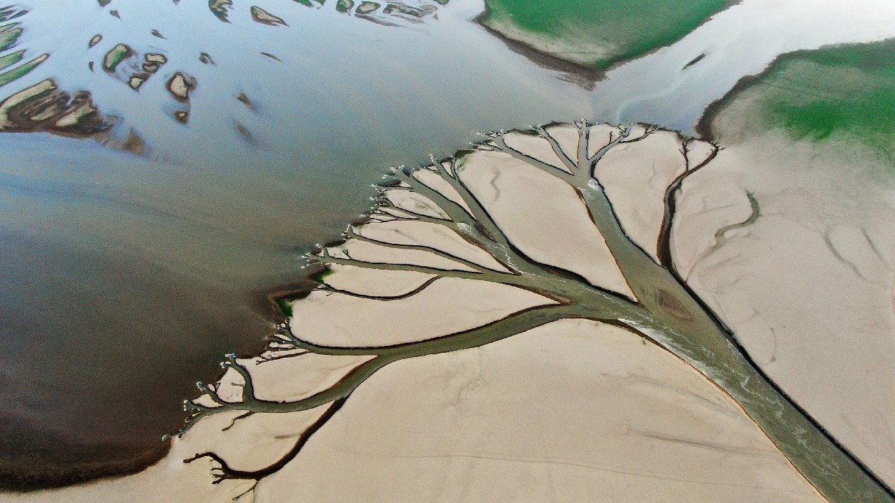 Its largest lake is so dry, China digs deep to water crops