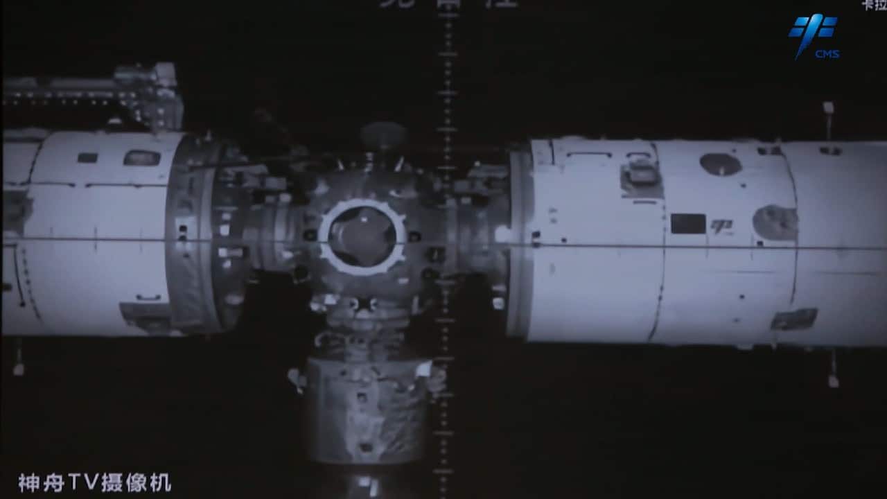 Chinese spaceship with 3 aboard docks with space station