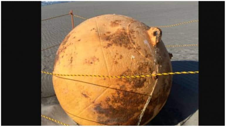 Mysterious iron ball washes up on Japan beach. Watch