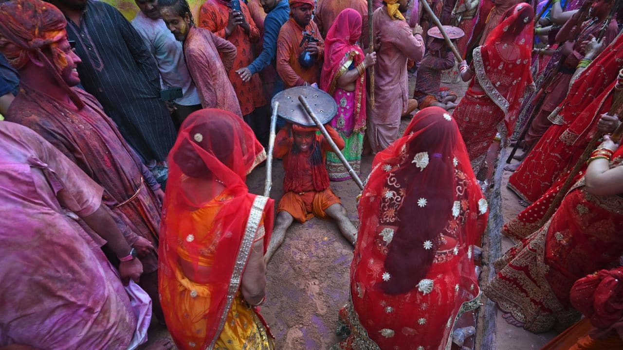Holi 2023: Women with sticks perform Indian festival ritual