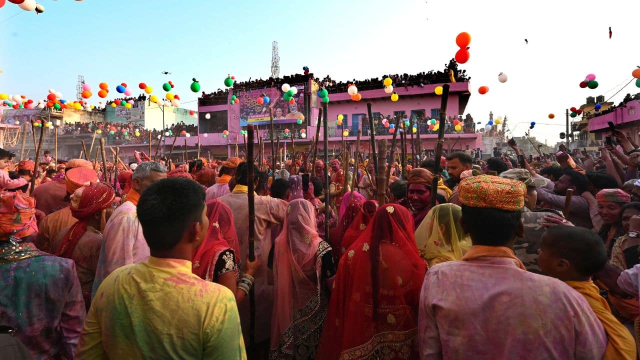 Holi 2023: Women with sticks perform Indian festival ritual ...
