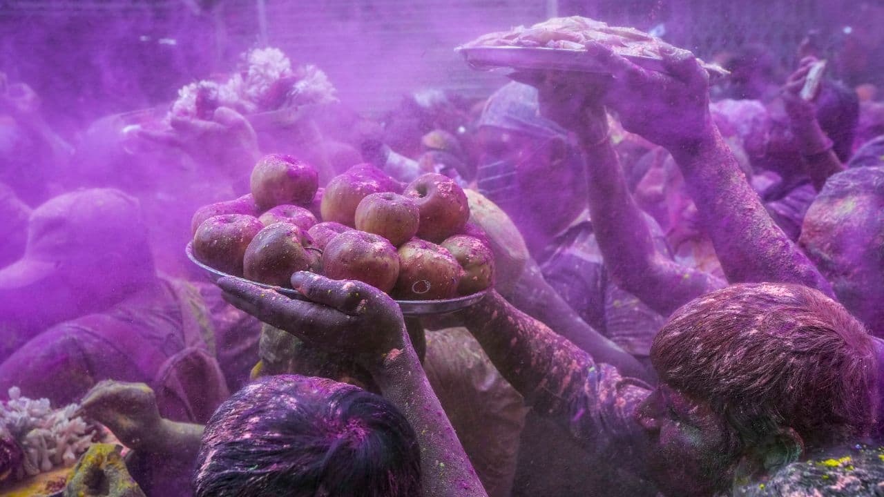 Holi 2023: Women with sticks perform Indian festival ritual ...
