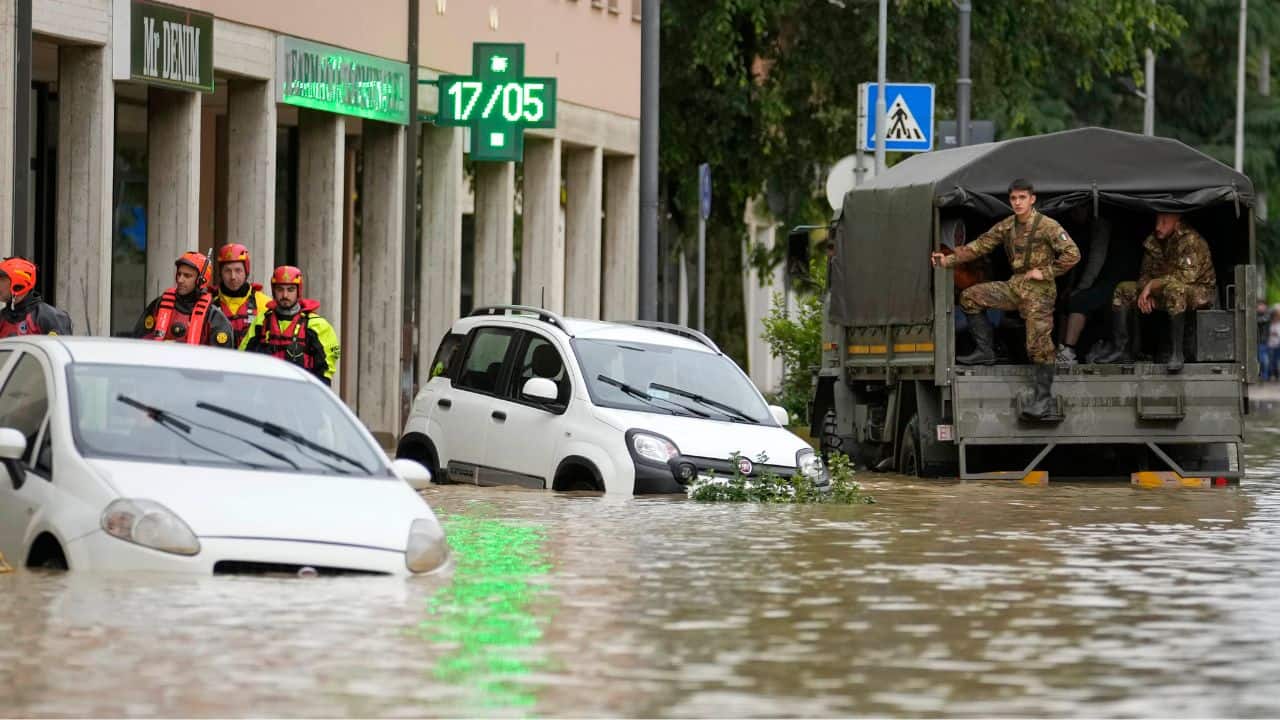 In Pics: Rescue workers reach Italian towns isolated by floods as death ...