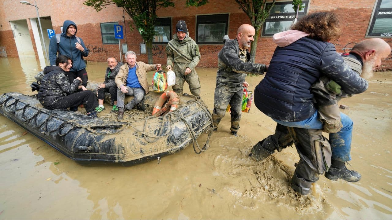 In Pics: Rescue workers reach Italian towns isolated by floods as death ...