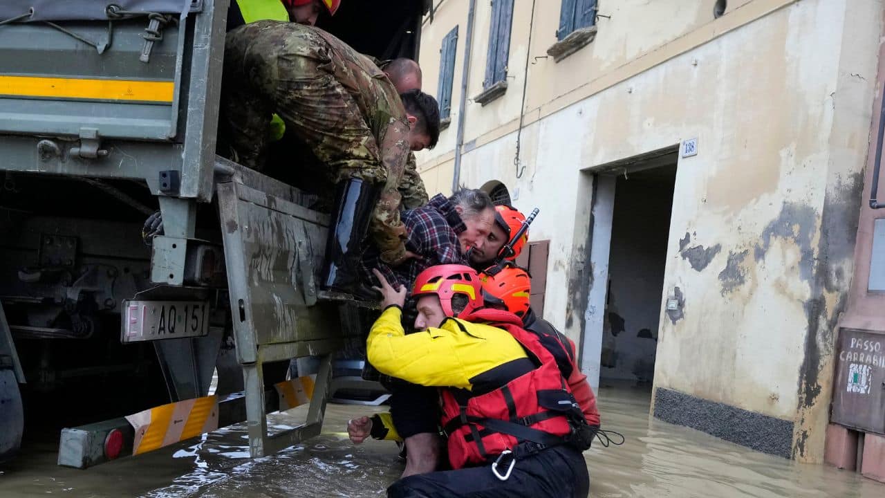 In Pics: Rescue workers reach Italian towns isolated by floods as death ...