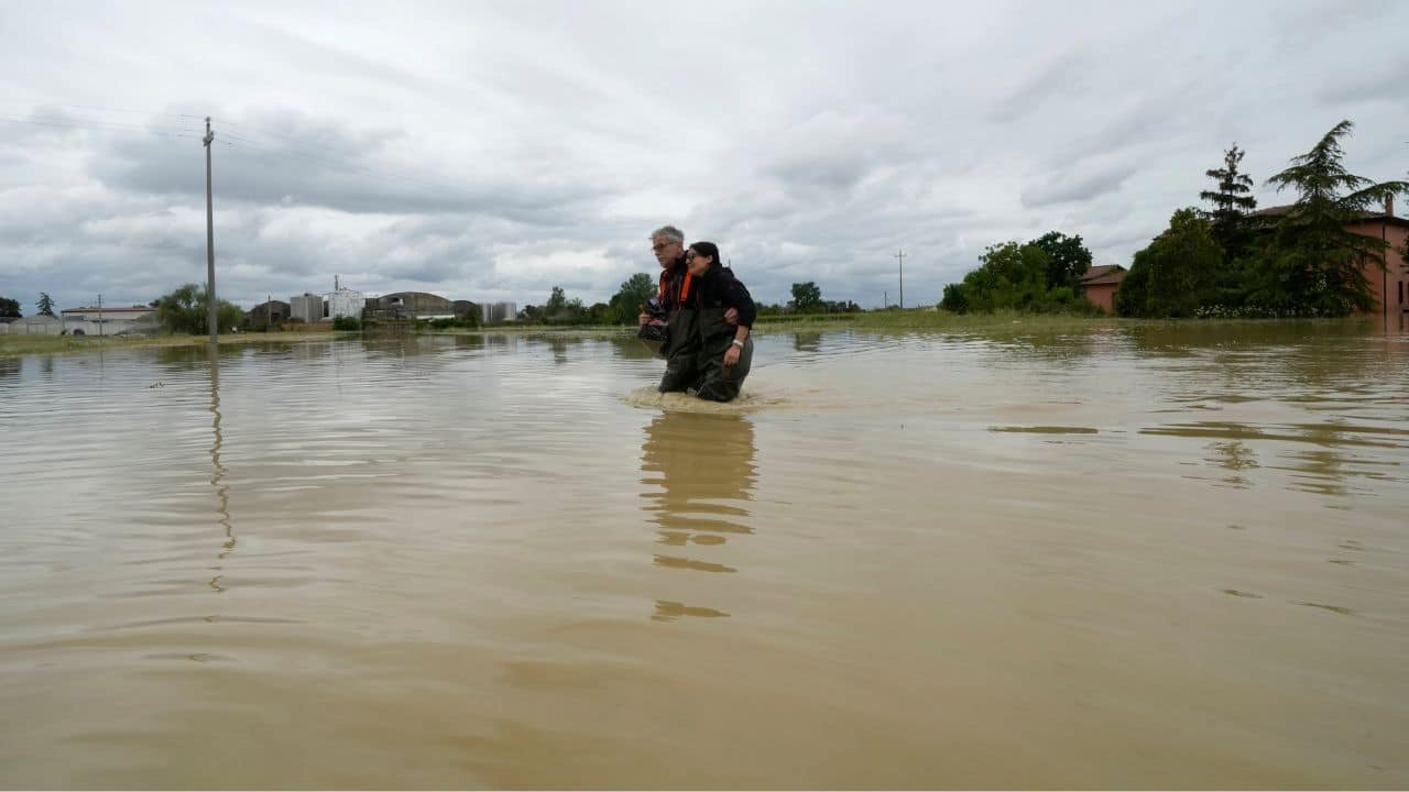 In Pics: Rescue workers reach Italian towns isolated by floods as death ...