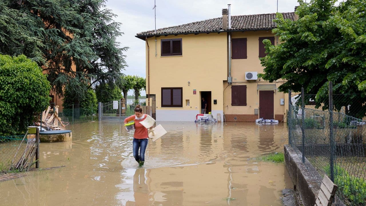 In Pics: Rescue workers reach Italian towns isolated by floods as death ...
