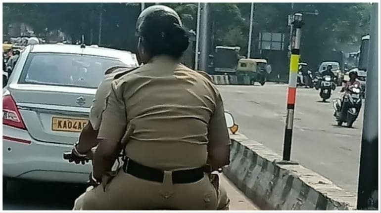 Bengaluru cop caught driving without wearing a helmet, owner fined