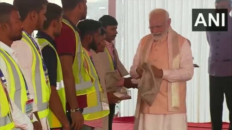 Watch: How PM Modi felicitated workers who helped build the new ...