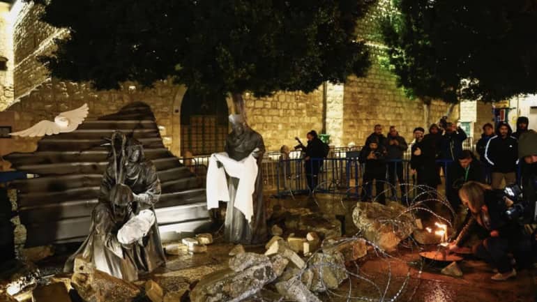 Sombre Bethlehem marks Christmas with vigil as bombs rain on Gaza