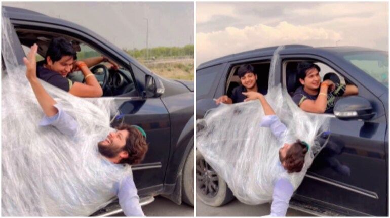 Man dangerously hangs from door of moving car with help of plastic ...