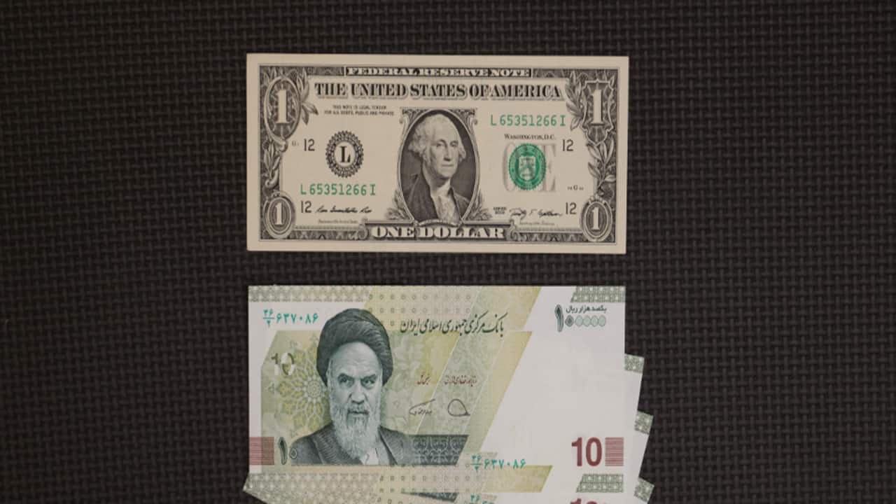 Iran's currency plunges to record low after Trump orders restart of ...