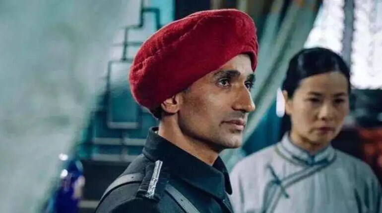 Who is Dev Raturi, a renowned actor in Chinese cinema who used to wash dishes in India