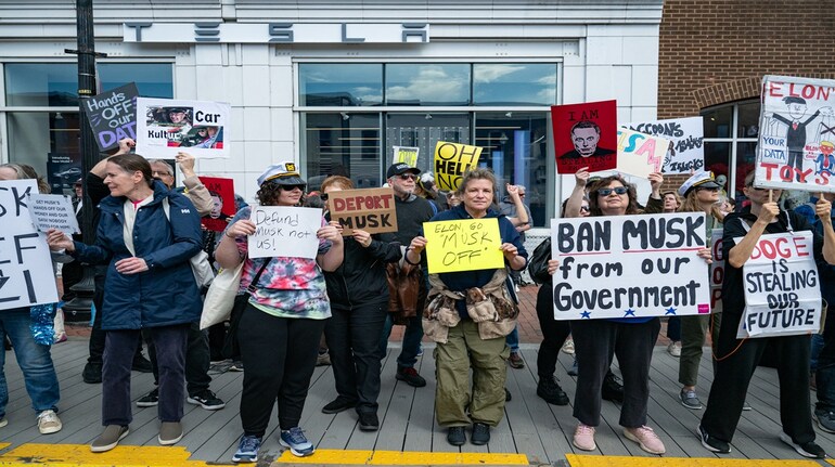 Anti-Musk protesters gather outside Tesla dealership in Washington