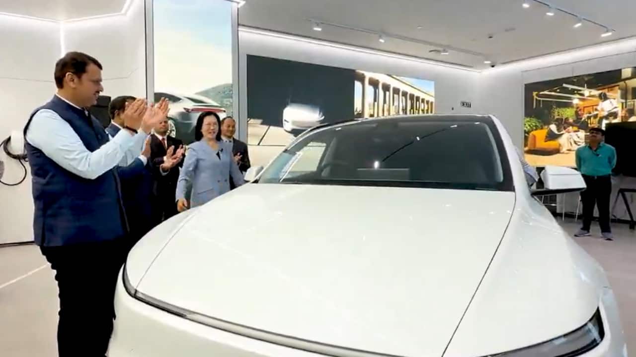 Fadnavis sits inside Tesla Model Y, inaugurates EV giant's first ...