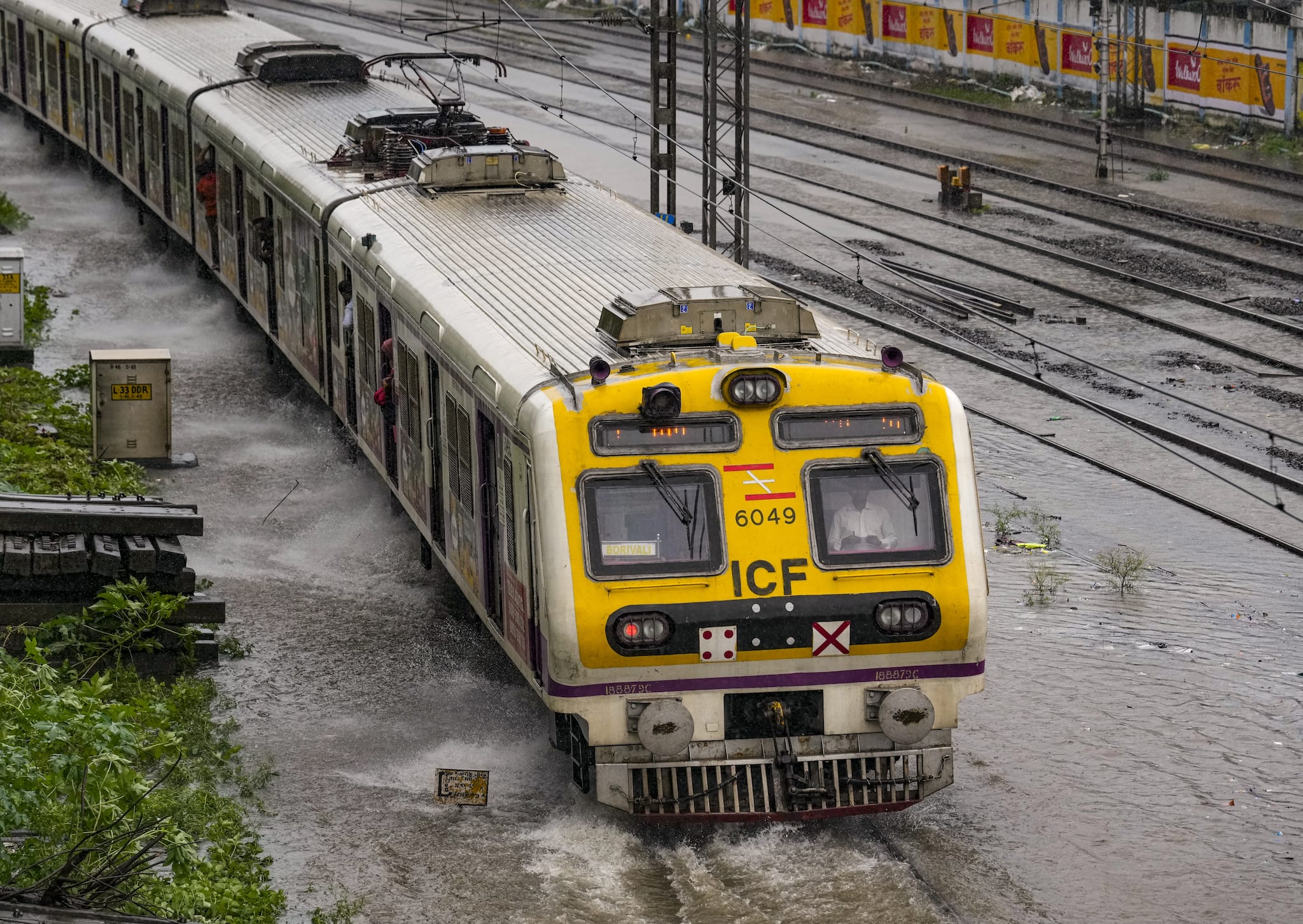 In pictures: Record rain, train chaos, monorail rescue as Mumbai reels ...